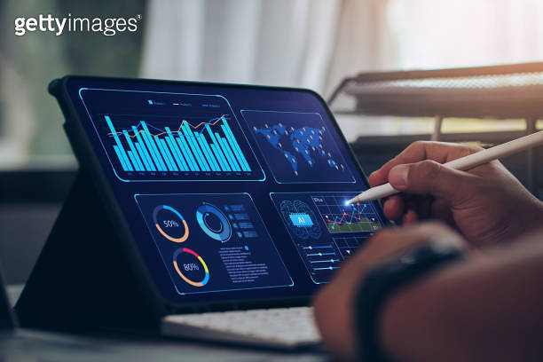Businessman using tablet Analytics Data KPI Dashboard Tech with charts ...