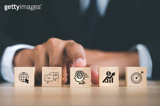 Ai technology, Artificial Intelligence. Businessman hand holding wooden ...