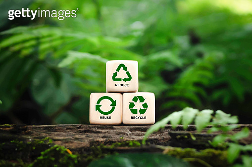 Reduce, reuse and recycle symbols on wood blocks as environmental ...