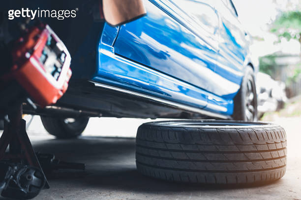 Repairing the breaks of a car after a street crash. Details and focus ...