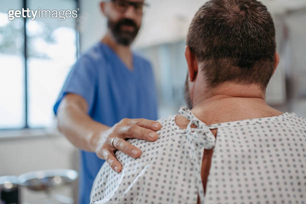Supportive doctor soothing a worried overweight patient, discussing ...