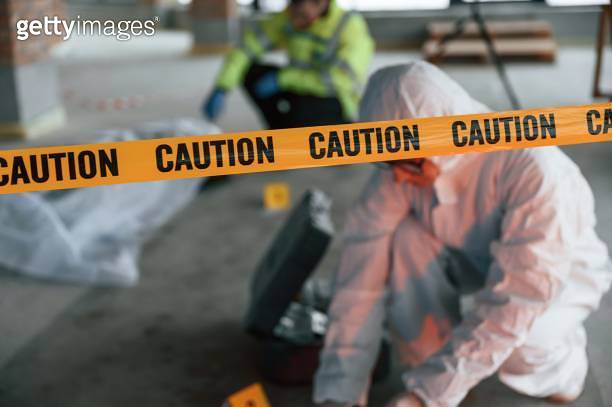 Caution police tape. Detectives are collecting evidence in a crime ...