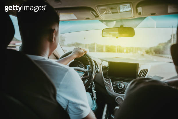 Man holding the cell phone and steering wheel while driving. Distracted ...