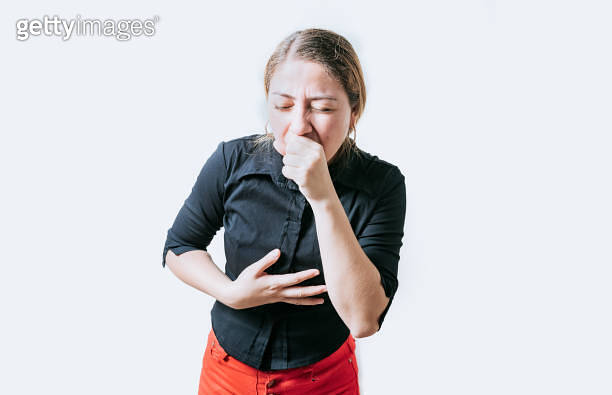 Young woman suffering from cough isolated. Girl with bronchitis ...