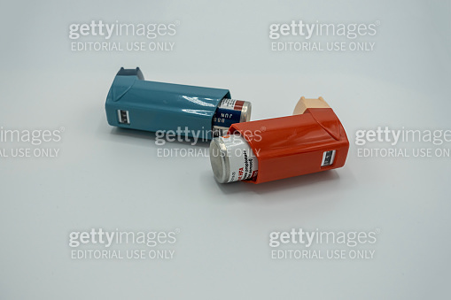 Close up view of Albuterol and Flovent inhalers on a white background ...