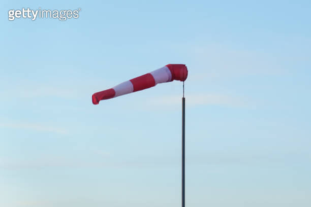 A red and white wind cone indicating the direction and strength of the ...