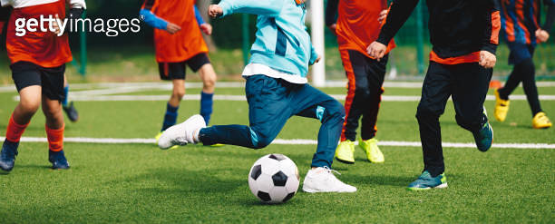 Children playing football game on a school tournament. Dynamic, action ...