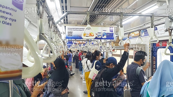 View inside the KRL commuter line train carriage. Crowded commuter line ...