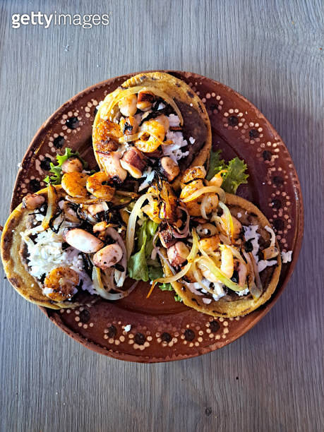Delicious dish of Sopes and seafood tostadas that are a fried tortilla ...
