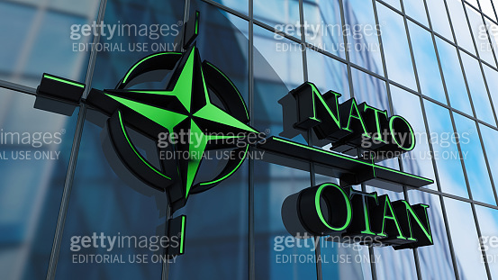 NATO OTAN Sign on Building's Window (1809242492) - 게티이미지뱅크