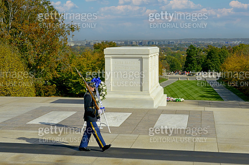 A lone soldier stands guard over the Tomb of the Unknown Soldier at ...