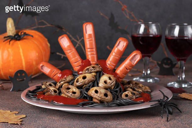 Themed food for Halloween - bloody hand from sausages with ketchup ...