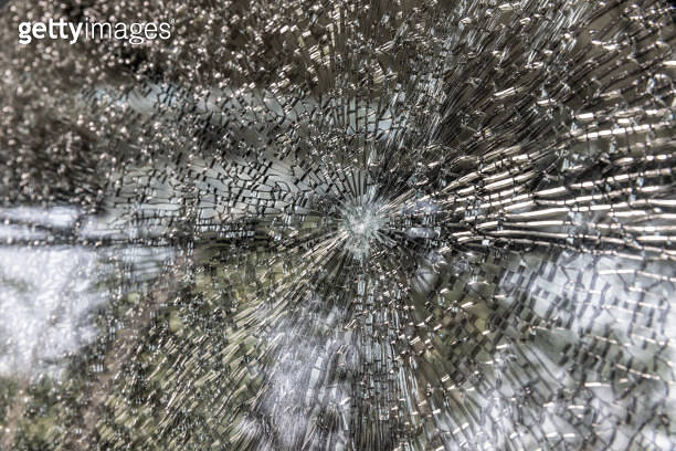 Broken windshield of a car close-up as a background. Texture broken ...