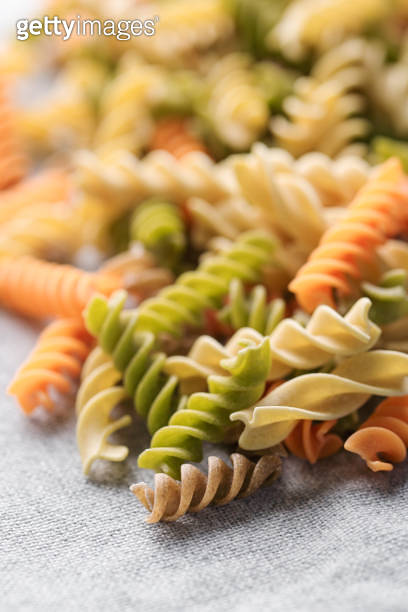 A variety of fusilli pasta made from different types of legumes, green ...