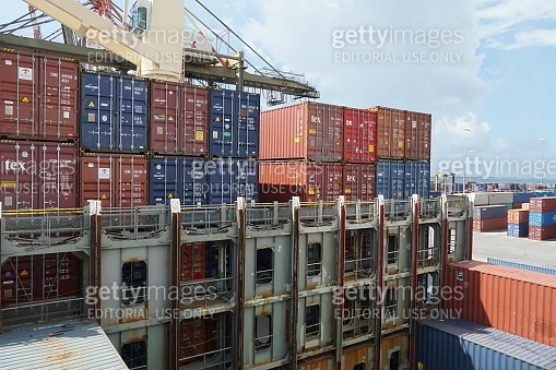 Cell guides and lashing bridges of container vessel with cranes ready ...