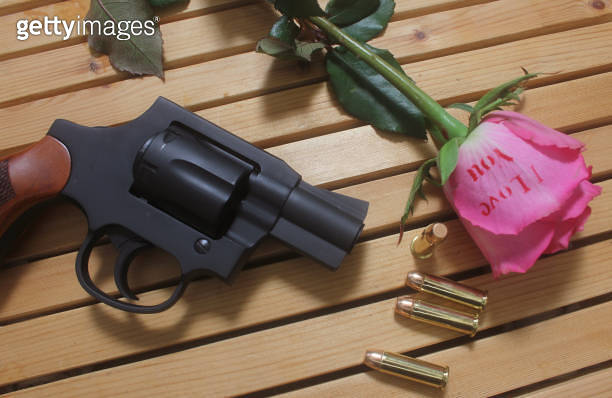Vintage Gun With Bullets and Rose. Revolver and Ammunition (2152681986 ...