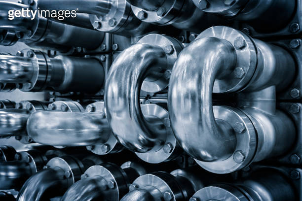 Metal blue curved pipes as an industrial concept background for a web ...