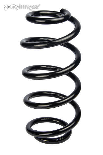 Car spare part. Large metal spring on white background. cushioning ...