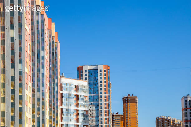 different types of multi-storey apartment building on blue sky 이미지 ...