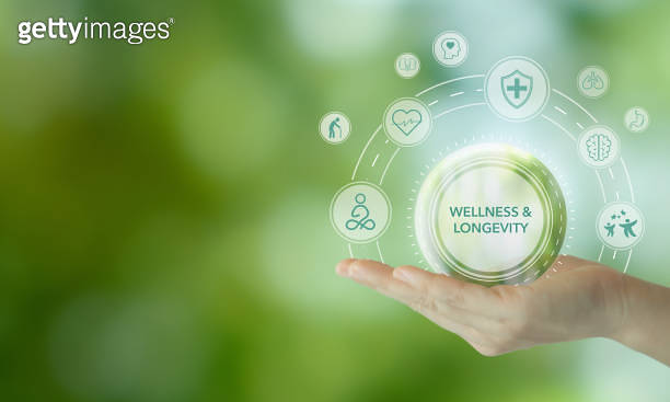 Wellness and longevity concept. A hand holds a digital representation ...