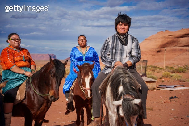 Young Navajo Family Riding Horseback on Their Ranch in Monument Valley ...