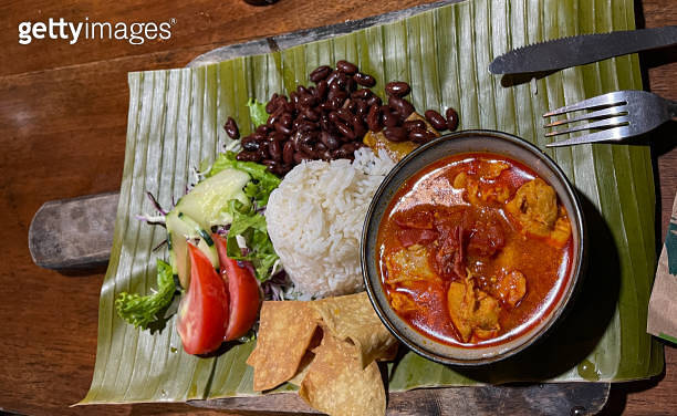 Traditional Costa Rican food, rice, vegetables and herbs on plate ...