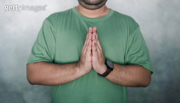 Portrait Asian young man pay respect, sawasdee symbol from Thailand ...