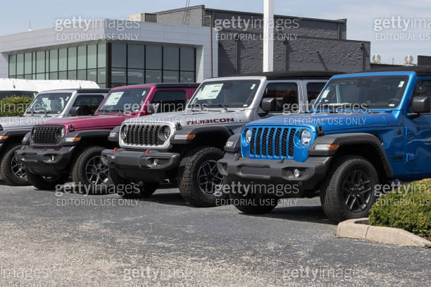 Jeep Wrangler display at a dealership. Jeep offers the Wrangler in ...