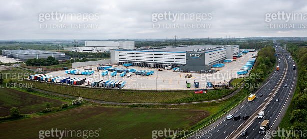 Aerial view of a large Amazon Prime distribution warehouse with ...