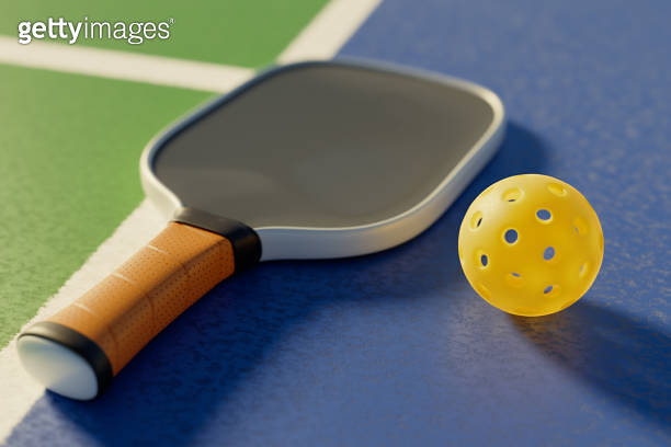 Close-up of a pickleball racket and ball lying on the court line 3D ...