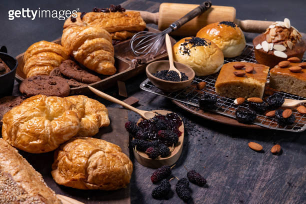 Table top view of organic rustic style bakery with whole grain bun ...