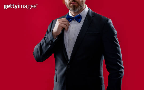 man wear tux formal suit, cropped view. man in tux isolated on red ...
