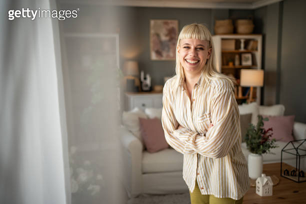 Portrait of a young woman with an interesting style standing in the ...