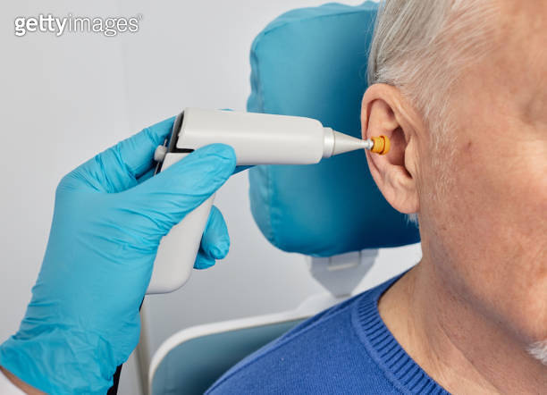 Portrait of mature man while tympanometry and test of middle-ear ...