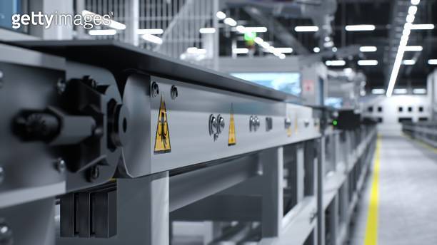 Safety measures stickers on assembly lines operated by heavy machinery ...