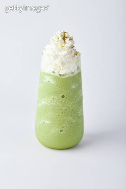 Matcha Green Tea Milkshake topped with whipped cream and green tea ...