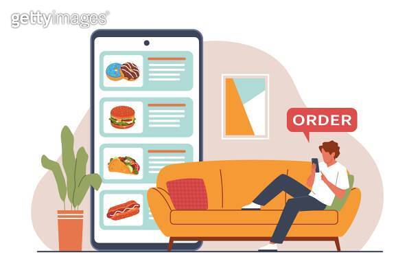 Fast food ordering app. Guy lying on couch and making remote order in ...