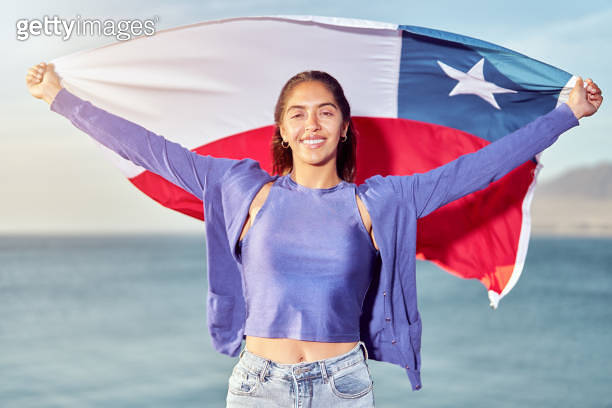 front view happy beautiful chilean woman holding a flag of Chile ...