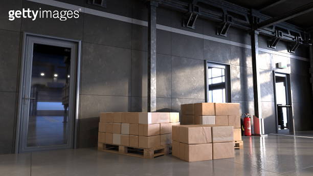 Clean warehouse with pallets and packages. Sunlight streams through ...