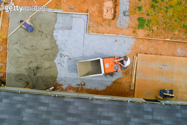 Self dumping track concrete buggy is used to pour wet cement into a ...