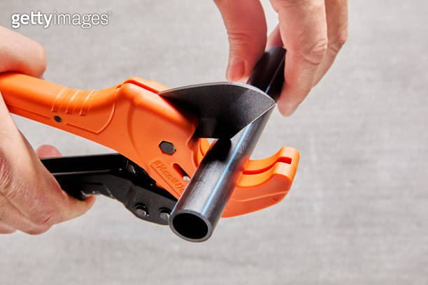 Using pipe cutter with ratcheting mechanism when installing sprinkler ...