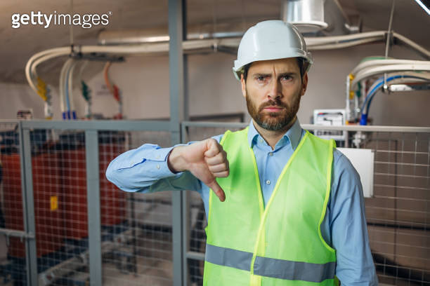 engineer man wearing safety helmet looking unhappy and angry showing ...