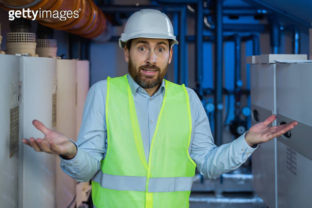 heating plant engineer man wearing uniform and security helmet have ...