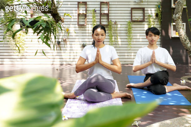Lifestyle woman and teenage student yoga exercise and pose for healthy ...