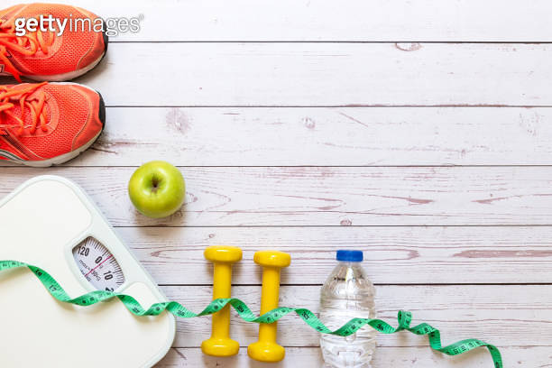 Diet and Healthy life loss weight Concept. Green apple and Weight scale ...