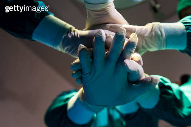 Close up hands group and teamwork of surgeons in hospital operating ...