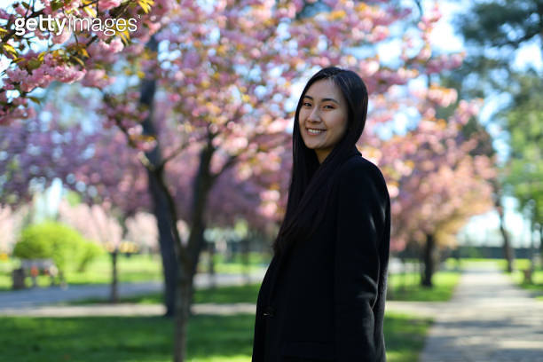 Friendly Japanese woman smiling happily, attractive young adult ...