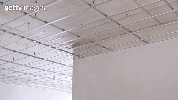 Aluminum c-line ceiling outline over corridor inside of modern house ...