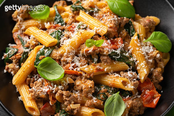 Creamy Tuscan pasta with minced beef, sun dried tomatoes, spinach and ...