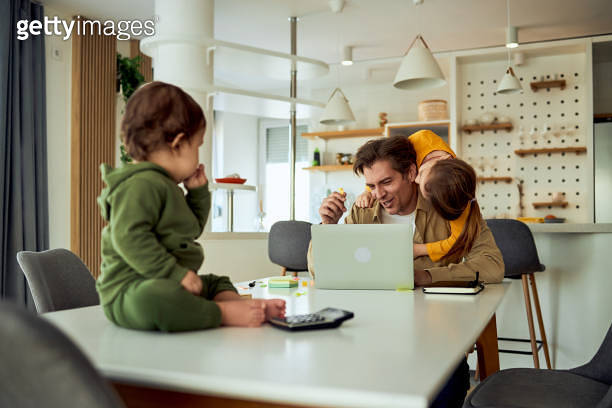 Father struggling to do some work while being home alone with his ...